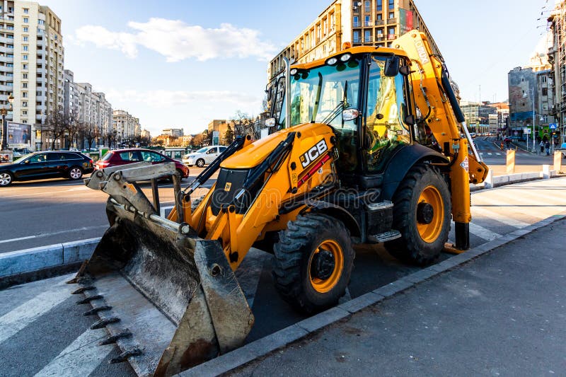 Excavator in Traffic. Industrial Equipment at Construction Site in ...