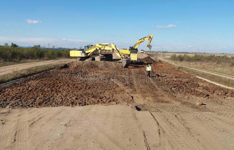 Excavator and truck editorial image. Image of bulldozer - 111991380