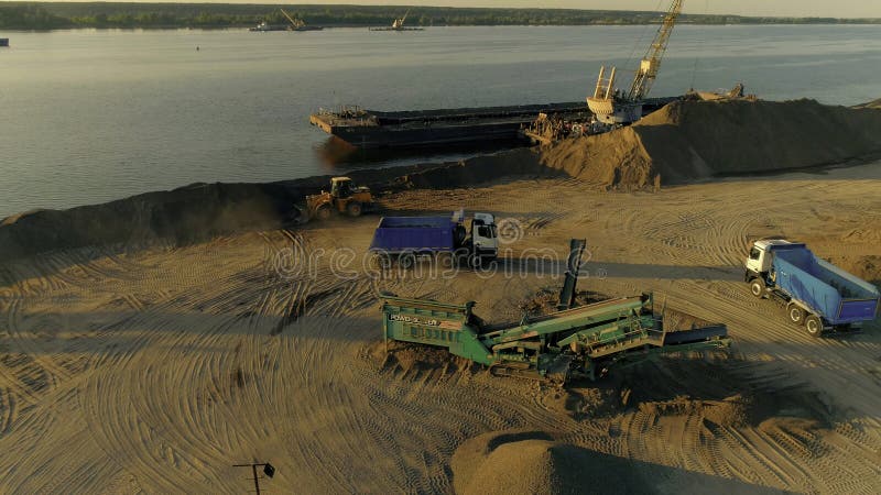 Excavator , Trucks and Cranes Working at the Construction Site. Scene ...