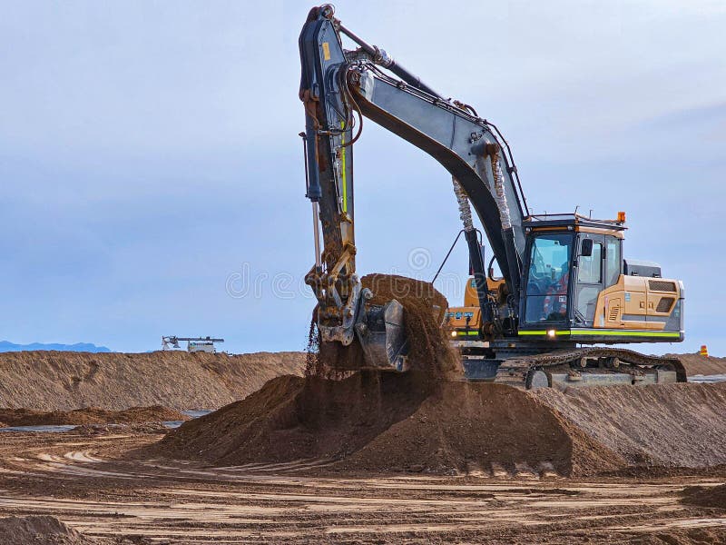Excavator Type Construction Machinery Working on Bulk Earthworks in a ...