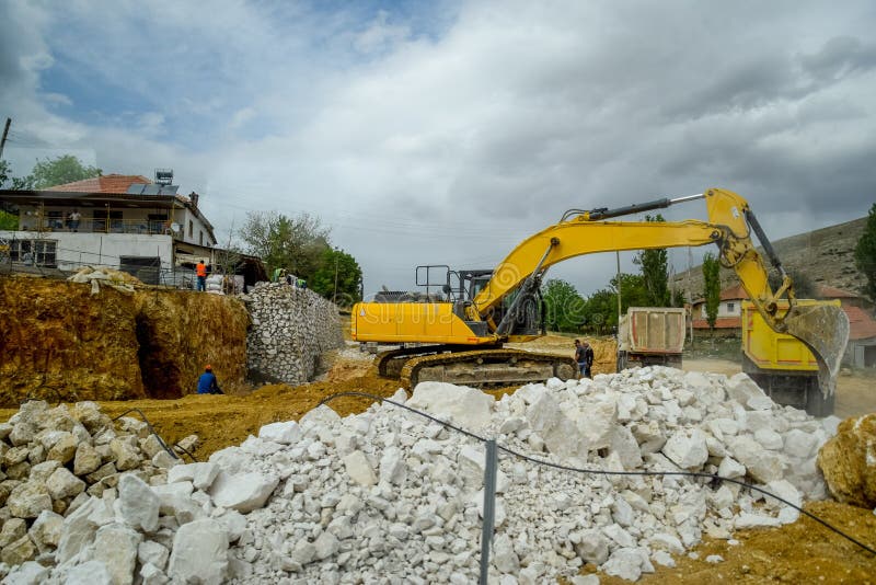 Excavator Work at Construction Site. Excavator Digs a Hole Stock Image ...
