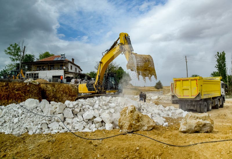 Excavator Work at Construction Site. Excavator Digs a Hole Stock Photo ...
