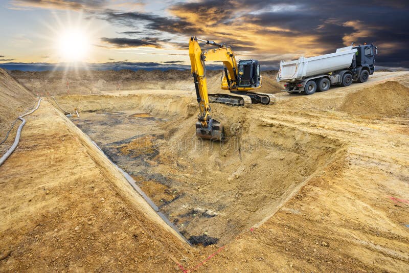 Excavator is in Work and Digging at Construction Site. Stock Photo ...
