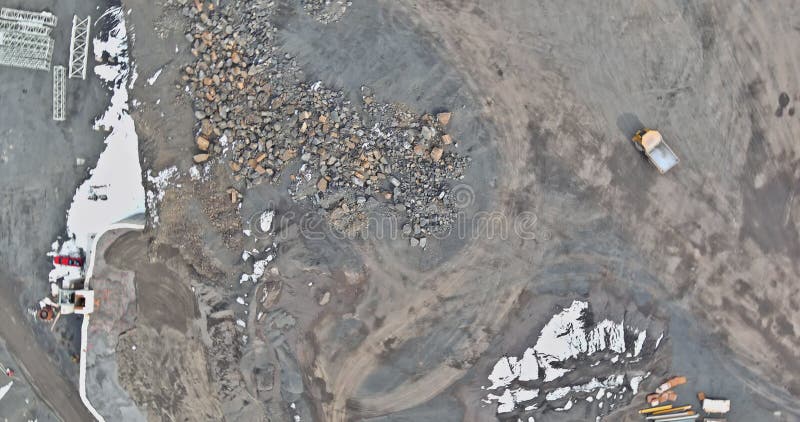 The Excavator at Work with Loading of Stone into Dump Truck on during ...