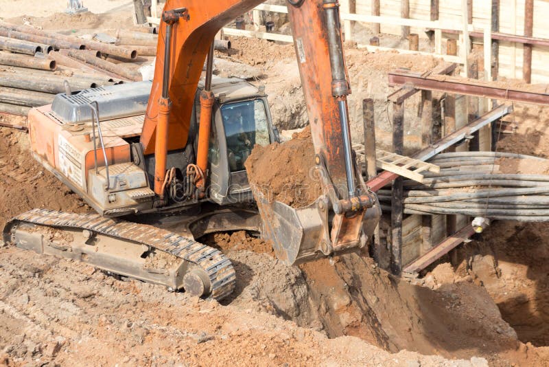 The Excavator is Working on a City Construction Site. Repair and ...