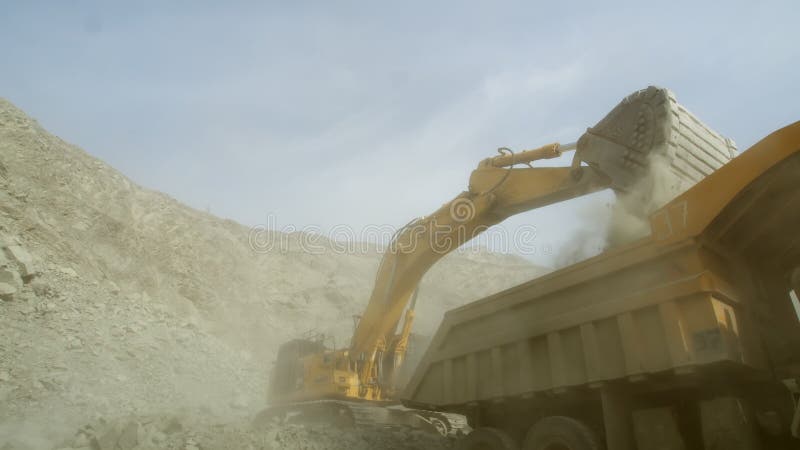 Excavator Working at Construction Site on Earthworks. Excavator Loading ...