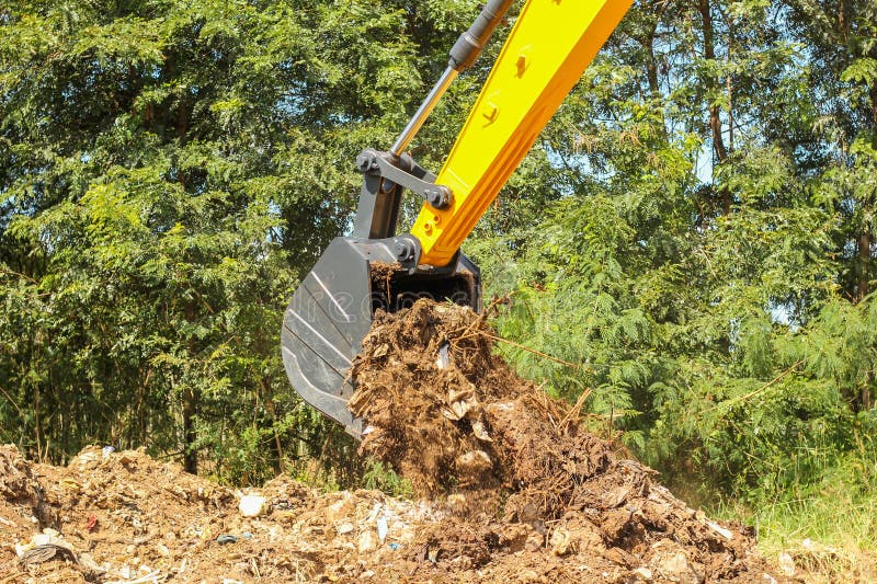 Excavator Working on Construction Site or Garbag Dump Stock Photo ...