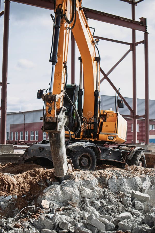 Excavator Working on Construction Site To Clear Rubble and Prepare for ...
