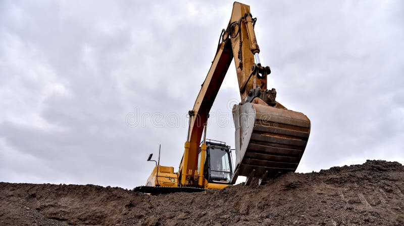 Excavator Working on Earthmoving at Open Pit Mining. Backhoe Digs ...