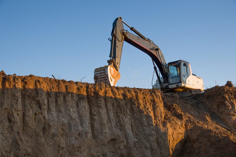Excavator Working on Earthmoving at Open Pit Mining. Backhoe Digs ...