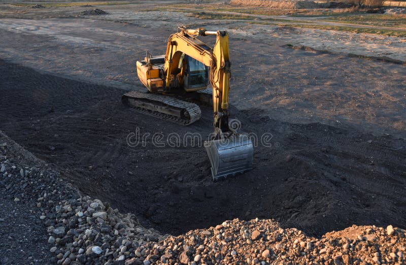 Excavator Working on Earthmoving at Open Pit Mining. Backhoe Digs ...
