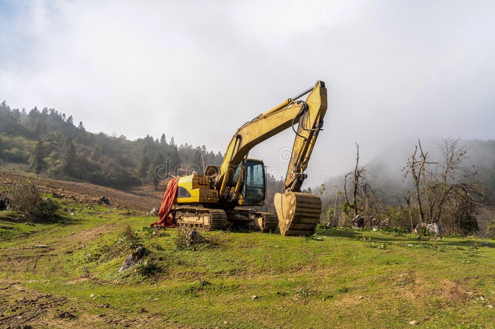 Excavator Working in the Field and Digging the Earth Stock Image ...