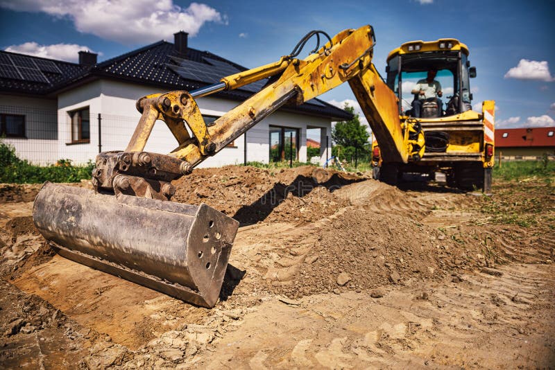 Excavator at House Construction Site - Digging Foundations for Modern ...