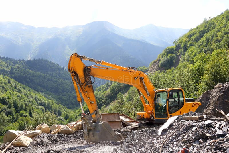 Excavator Working on Road Construction in Mountainous Terrain Stock ...