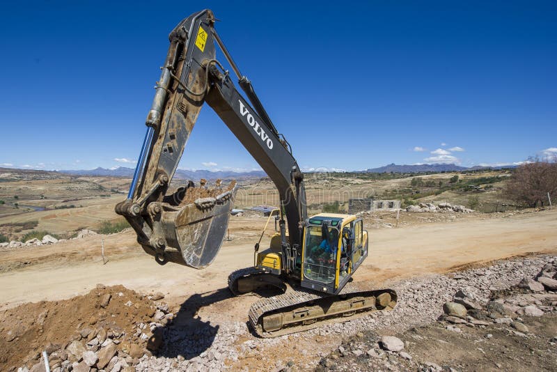 Excavator working on road. editorial stock image. Image of epic - 47422324