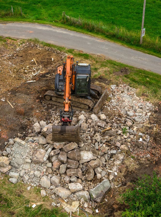 Excavator Working on Rocky Ground Near Road.. Stock Image - Image of ...