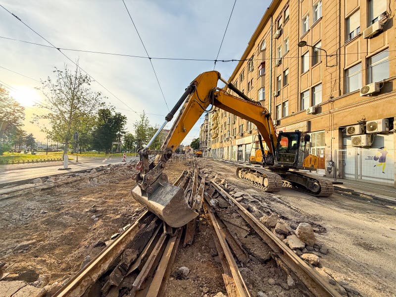 Excavator Working on Tram Track Dismantling. City Infrastructure Under ...
