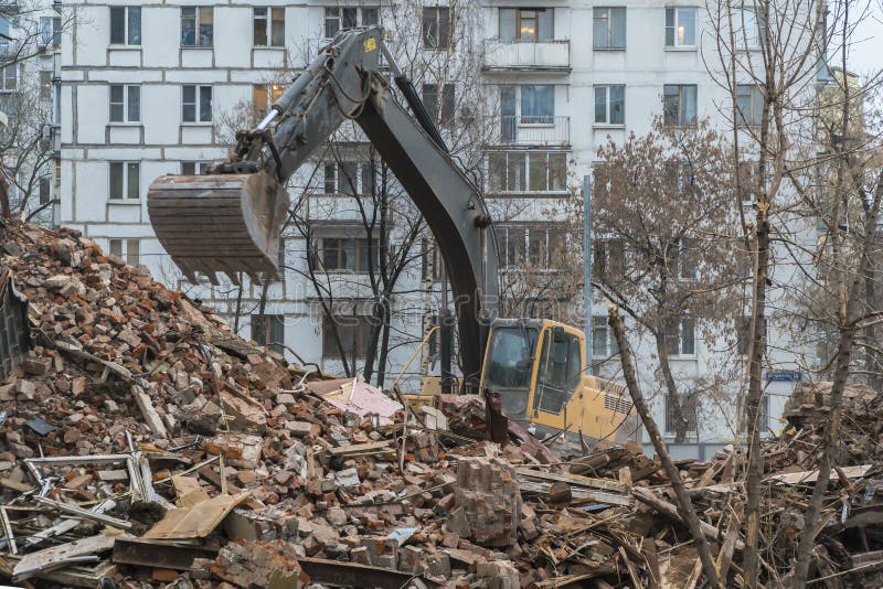 Excavator Working on the Wreckage of the Building Stock Photo - Image ...