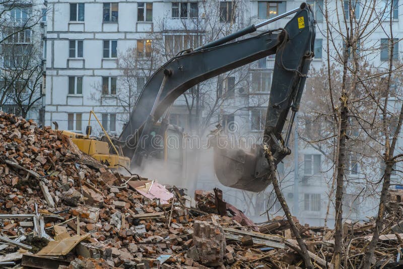 Excavator Working on the Wreckage of the Building Stock Image - Image ...