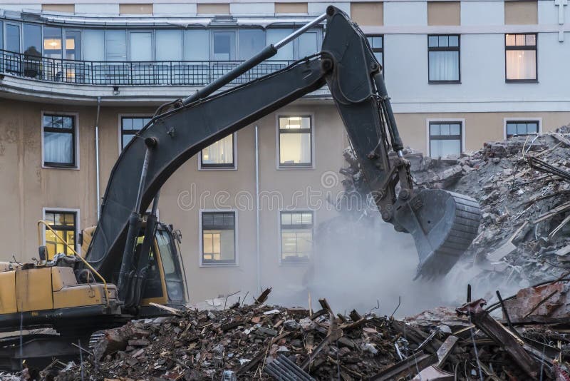 Excavator Working on the Wreckage of the Building Stock Photo - Image ...