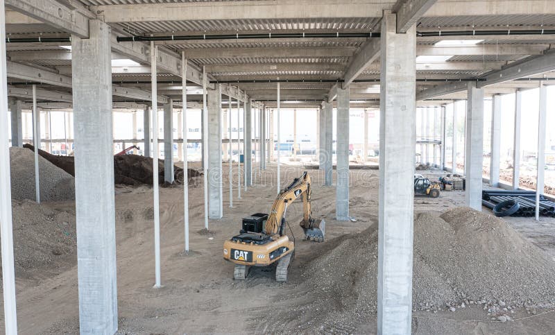 Excavator Working on a Yard for the Construction Industry. Stock Photo ...