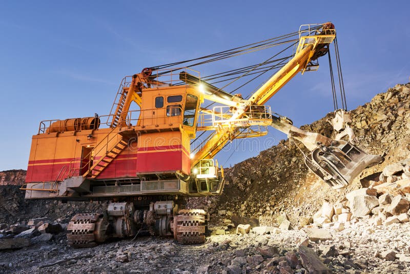Excavator Works with Granite or Ore at Opencast Mining Stock Image ...