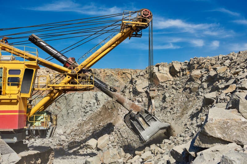 Excavator Works with Granite or Ore at Opencast Mining Stock Photo ...