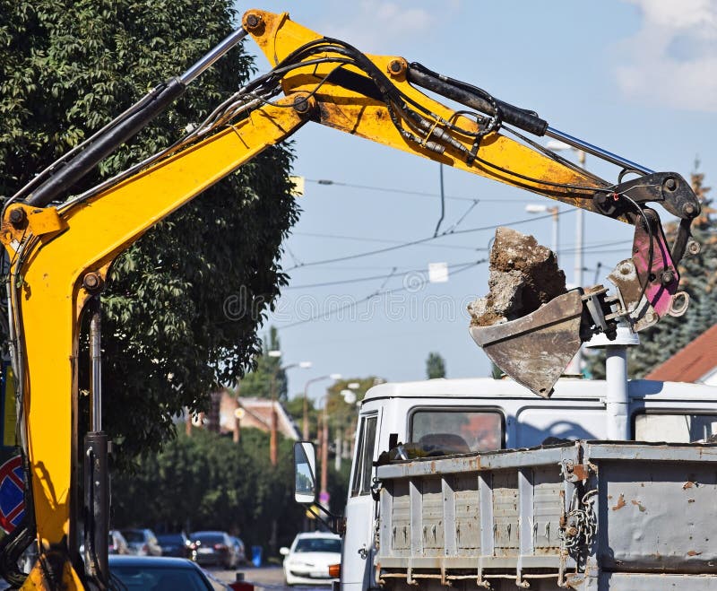 Excavator Works at the Road Construction Stock Image - Image of ...