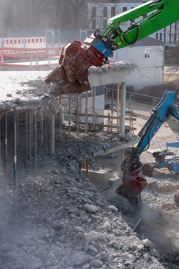 Excavators with Breakers Demolishing a Concrete Building Stock Photo ...