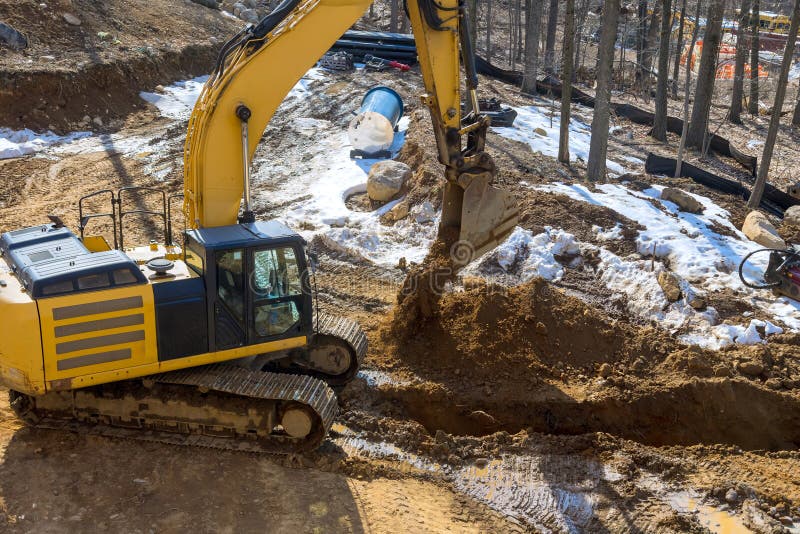 Excavators Dig Trenches on a Construction Site during Earthmoving Works ...