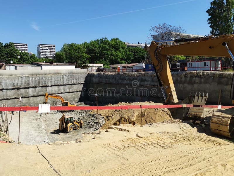 Excavators are Digging a Foundation Pit for a Large Building Stock ...