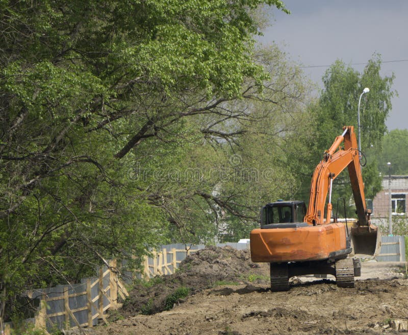 Excavators Digging the Ground Feathers Light. Stock Photo - Image of ...