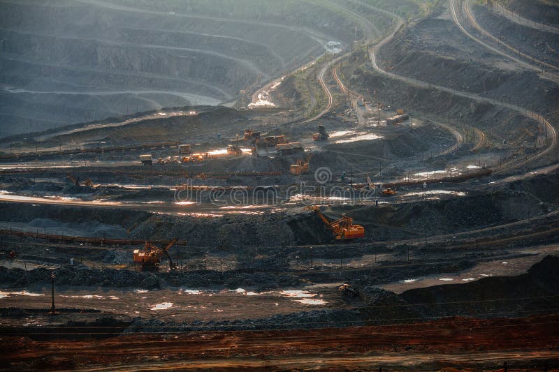 Excavators and Dump Trucks Working on Earthmoving at Open Pit Mine in ...