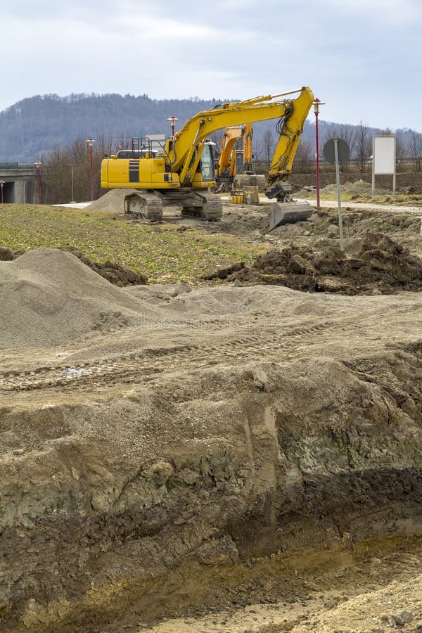 Excavator at a Construction Site Stock Photo - Image of dredger, heavy ...