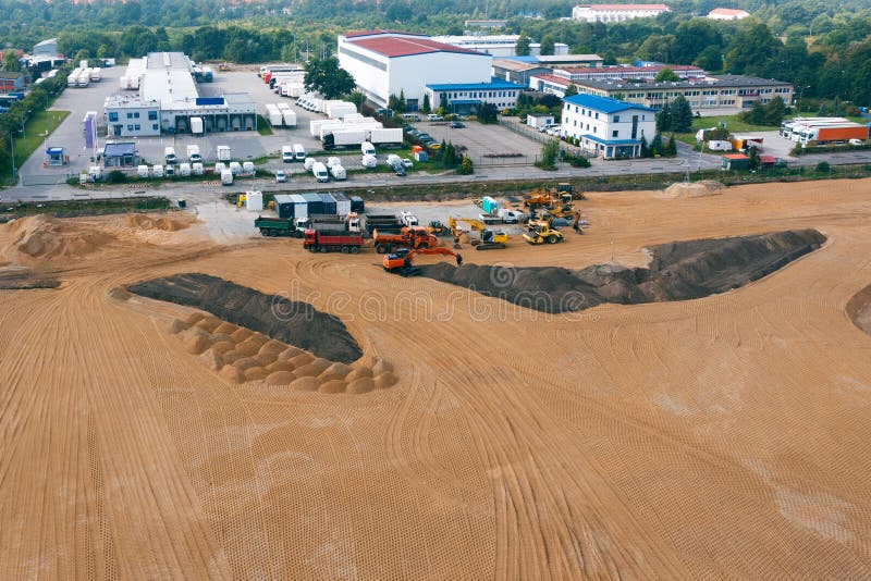Excavators and Other Construction Equipment Working at a Construction ...