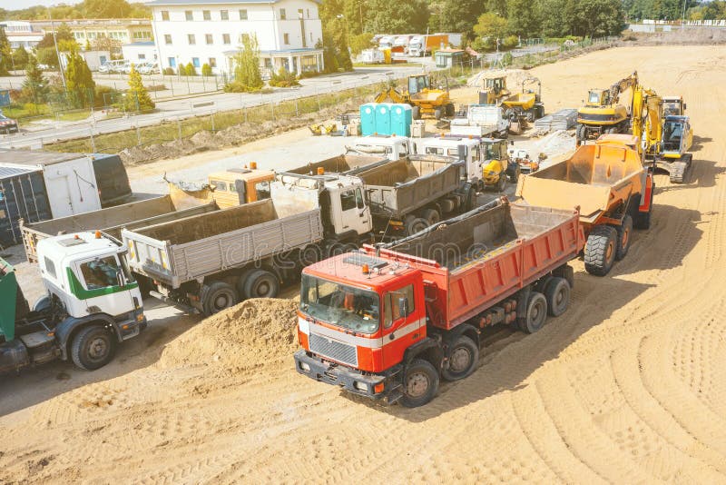 Excavators and Other Construction Equipment Working at a Construction ...