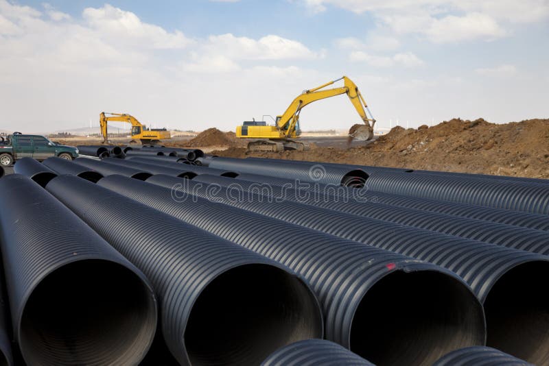 Excavator Digging Ditch Alongside Newly Built Road Stock Photos - Free ...