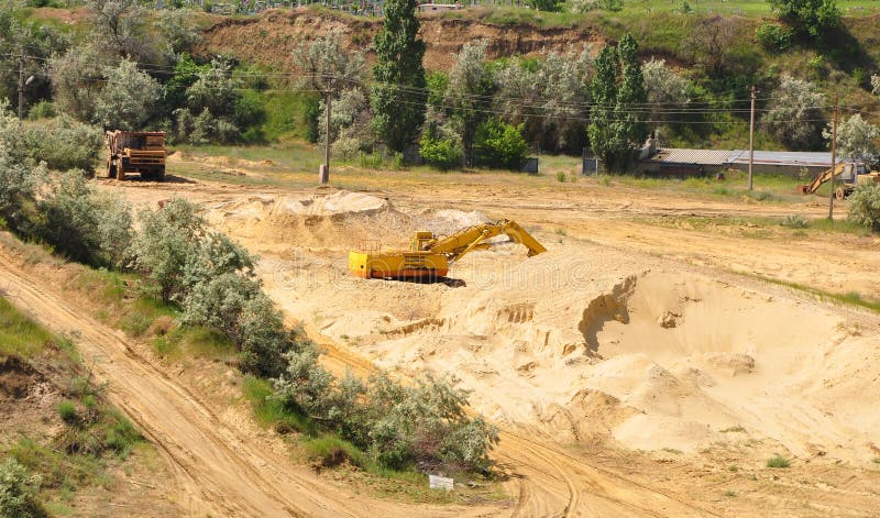 Excavators in the sand pit stock photo. Image of excavator - 25631718