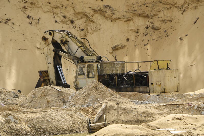 Excavators at a Sand Quarry. Big Orange Digger in Open Sand Mine is ...