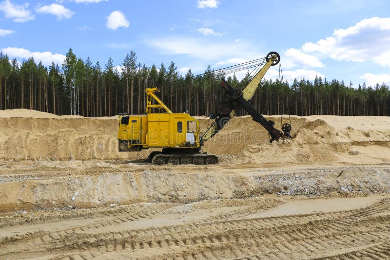Excavators at a Sand Quarry. Big Orange Digger in Open Sand Mine is ...