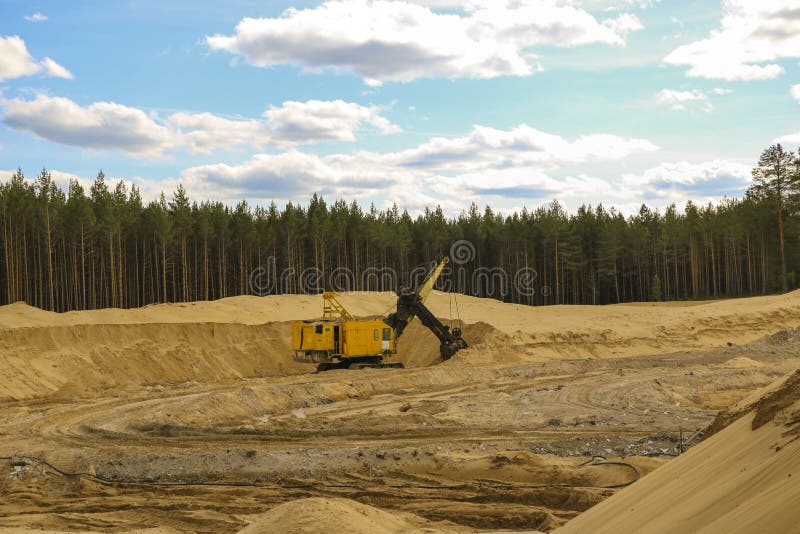 Excavators at a Sand Quarry. Big Orange Digger in Open Sand Mine is ...