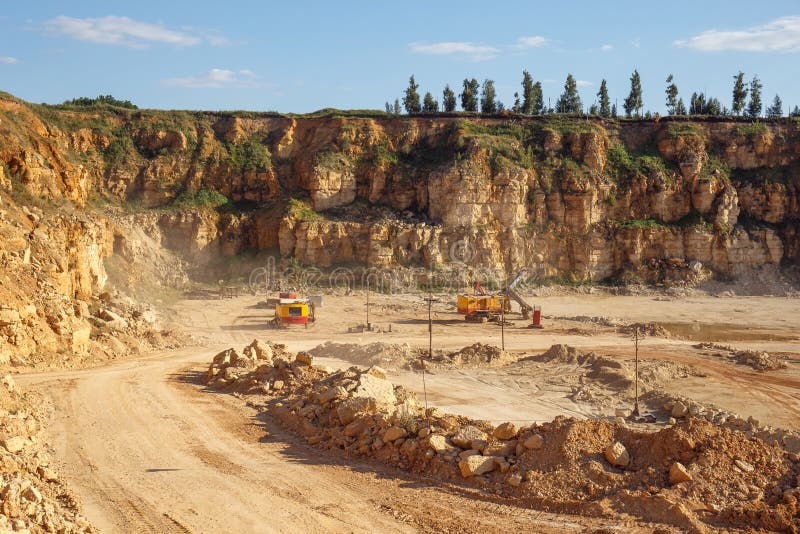 Excavators and Vehicles Works in Quarry. Mining Concept Stock Photo ...