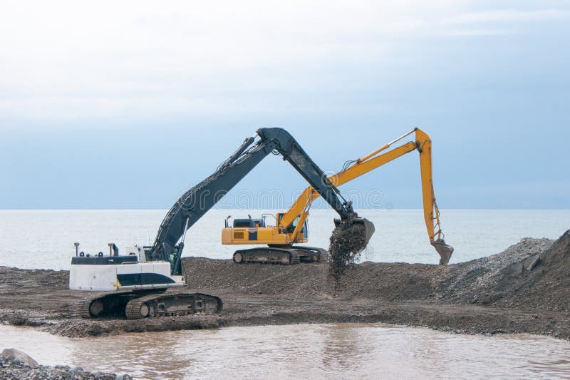 2 Excavators Work at a Construction Site Stock Image - Image of ...