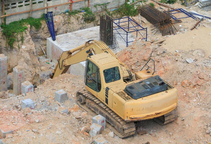 Excavators Work Dig a Hole in Construction Work Industry at Building ...