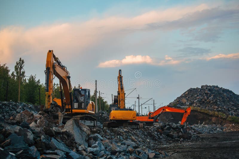 Excavators and Dump Trucks Working on Earthmoving at Open Pit Mine in ...