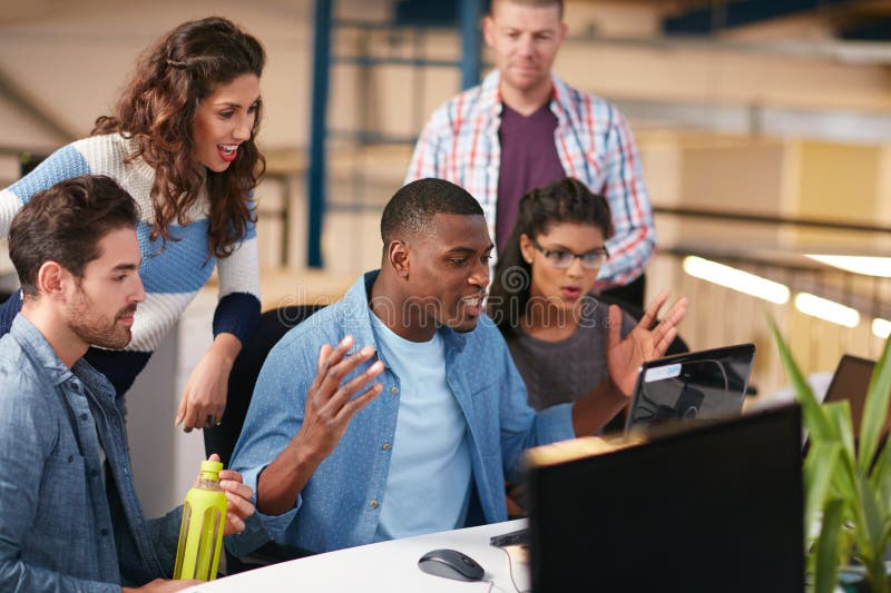 We Exceeded Our Target Another Month in a Row. Team of Colleagues Using a Computer Together in a ...