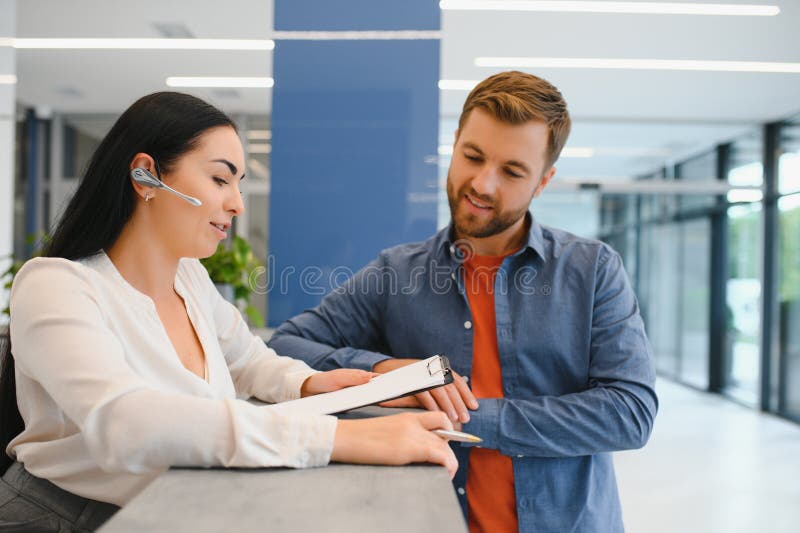 Excellent Service. Nice Friendly Woman Talking To the Client while ...