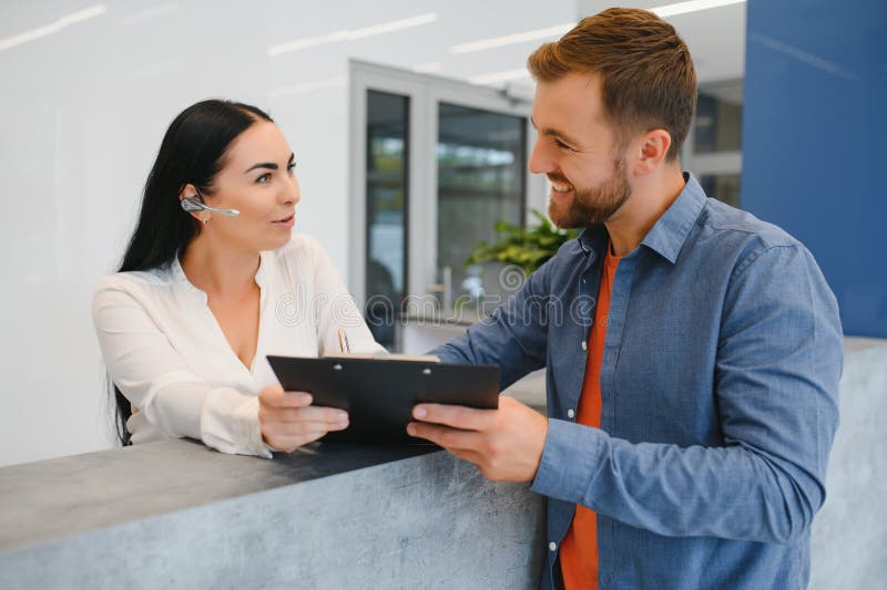 Excellent Service. Nice Friendly Woman Talking To the Client while ...