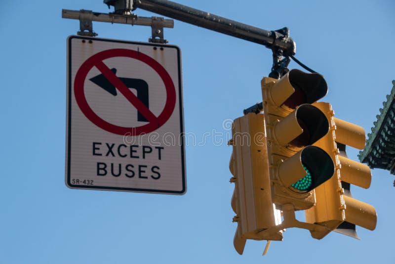 Except Buses Sign and a Yellow Traffic Light. Stock Photo - Image of ...
