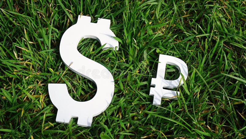 Exchange Rate. the Russian Ruble and the Dollar Sign on Grass. Stock ...